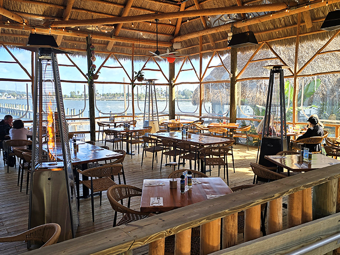 Dining under a thatched roof with water views? This isn't vacation&mdash;it's Tuesday in Florida if you're lucky enough to snag a table here.