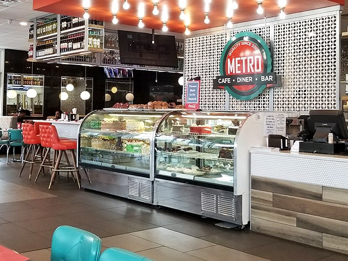 Inside, the dessert case stands like the Louvre of layered sweets, while turquoise and red seating pops against modern decor&mdash;diner DNA with contemporary chromosomes.