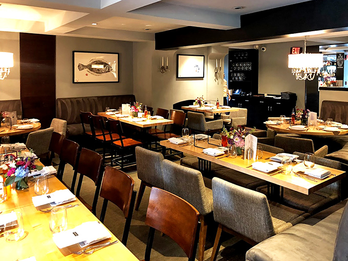 Where elegance meets comfort &ndash; notice the fish artwork subtly hinting at the seafood treasures awaiting your palate.