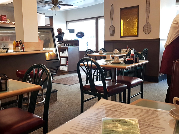 Classic diner aesthetics with those burgundy chairs and simple decor &ndash; like stepping into a breakfast time machine where the food matters more than the furniture.