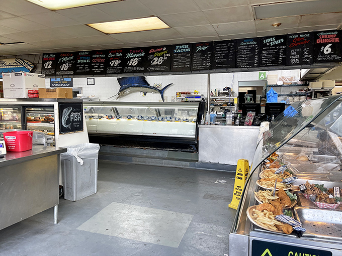 Where seafood shopping becomes an interactive sport. The display case is basically Netflix for fish lovers—endless scrolling, impossible decisions.
