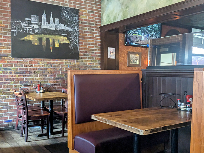 Cozy wooden booths and exposed brick walls create that perfect "neighborhood joint" vibe, where Cleveland pride hangs on the wall and comfort awaits at every table.