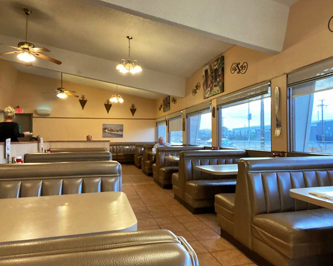 Vinyl booths and ceiling fans create that timeless diner atmosphere where conversations flow as freely as the coffee.