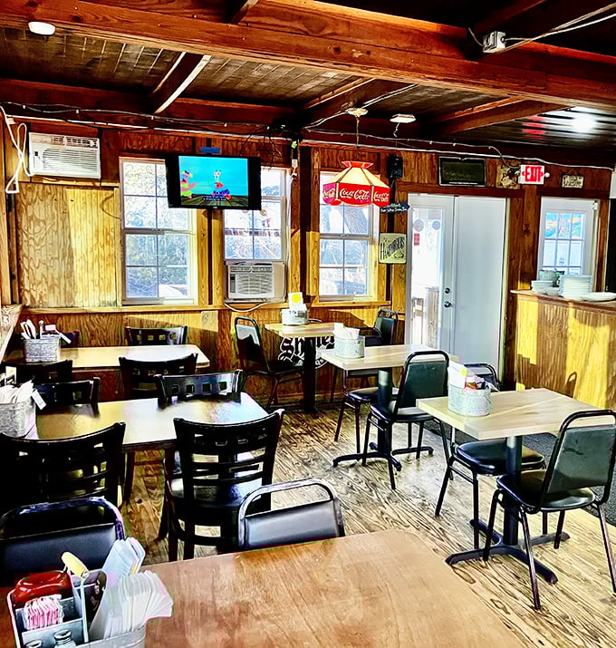 Inside, wood-paneled walls and simple furnishings create the perfect backdrop for culinary magic. No pretension, just honest comfort.