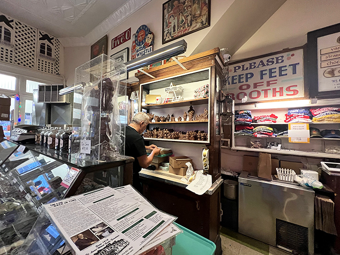 Step back in time at Crown Candy Kitchen's counter, where vintage memorabilia and glass display cases house treasures sweeter than your childhood memories.