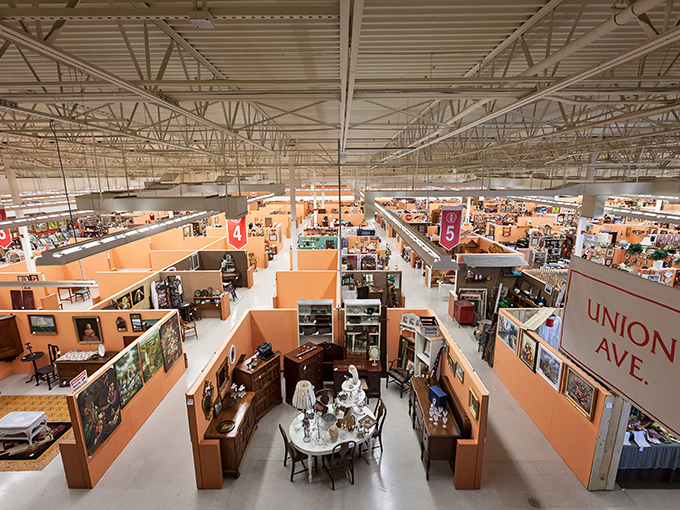 From this bird's-eye view, the labyrinth of orange-walled booths stretches like a miniature city of nostalgia, each street named and numbered for explorers.