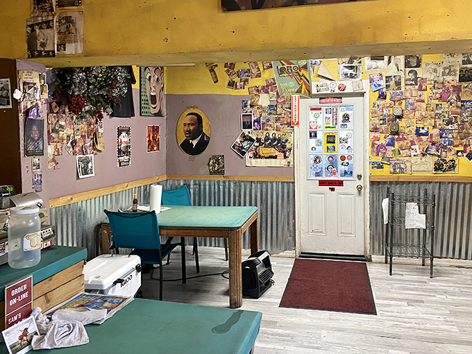 Inside Sam's, every inch tells a story. Yellow walls plastered with memories, corrugated metal wainscoting, and simple turquoise tables create an unpretentious barbecue sanctuary.