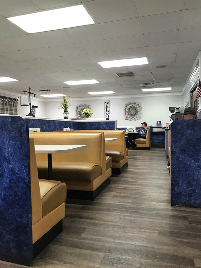 Classic diner comfort with blue dividers and tan booths. This isn't designer d&eacute;cor&mdash;it's the authentic stage where breakfast dreams come true.