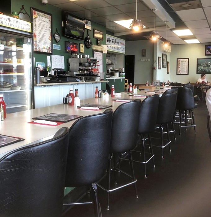 Counter seating: where breakfast voyeurs can witness the morning ballet of spatulas and coffee pots while contemplating life's important questions, like "hash browns or home fries?"