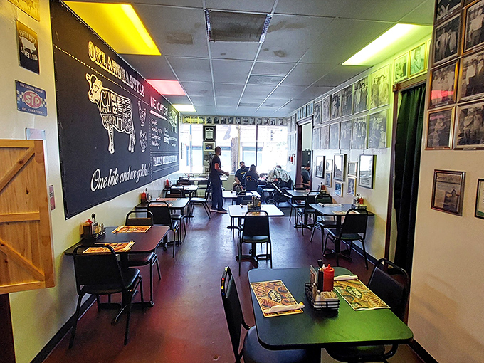 Inside, the chalkboard wall maps out bovine geography while simple tables promise no distractions from the serious business of barbecue appreciation.