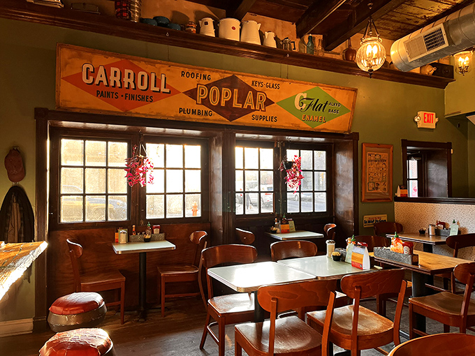 Vintage hardware store signs and warm wooden accents create that rare atmosphere where hipsters and grandparents feel equally at home. Comfort transcends generations.