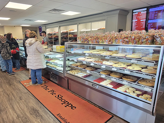 Pie paradise found! The display cases stretch like a dessert runway, where customers contemplate life's most important decision: which heavenly creation to take home.