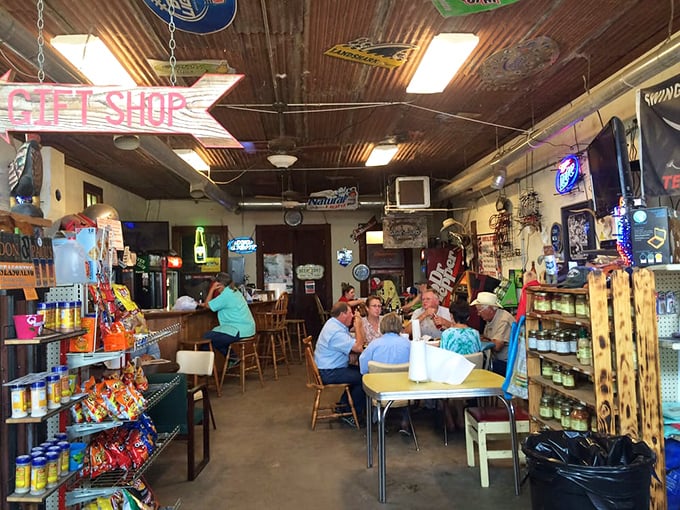 Inside, time stands still as locals gather around mismatched tables beneath a tin ceiling adorned with decades of memorabilia &ndash; this is Texas conversation headquarters.