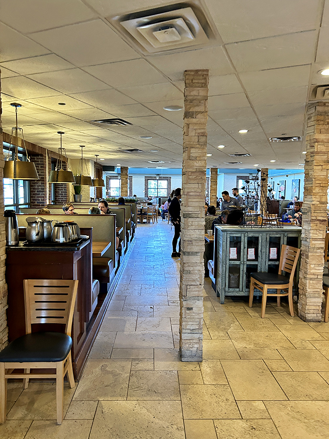 Stone columns and cozy booths create that perfect "treat yourself" vibe &ndash; fancy enough for a special occasion, casual enough for your weekend sweatpants.