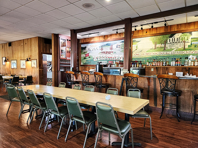 Rustic wood paneling and family-style tables create the perfect backdrop for conversations that flow as freely as the gravy.