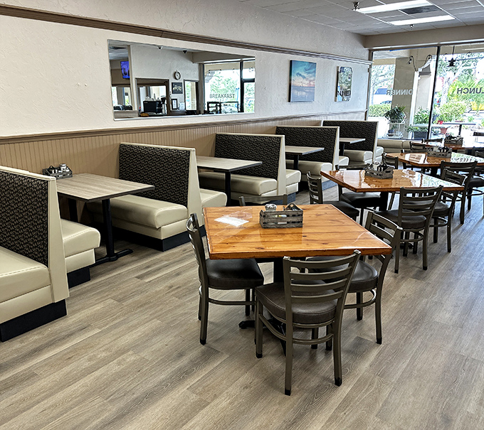 Inside Popi's Place, comfortable booths await like old friends ready for a long catch-up session over coffee and comfort food.