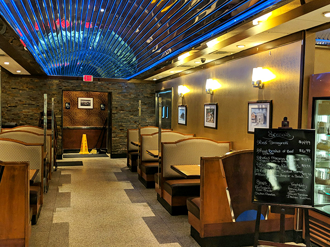 Step inside to discover the diner's distinctive blue ceiling and warm wood tones. The cozy booths practically whisper, "Sit down, stay awhile."
