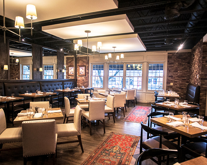 Exposed brick walls, elegant lighting, and those gorgeous area rugs create the perfect backdrop for food that demands your full attention.