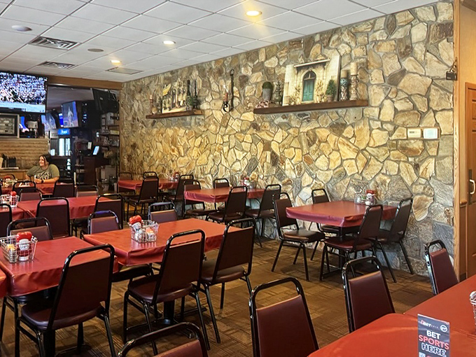 Inside, stone walls and red-topped tables create that perfect "everybody knows your name" vibe where memories are made between bites of legendary wings.