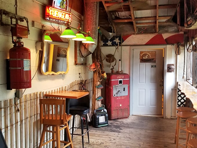Step inside and time slows down. The vintage Coca-Cola machine, green-shaded lights, and weathered wood floors whisper stories of countless seafood feasts past.