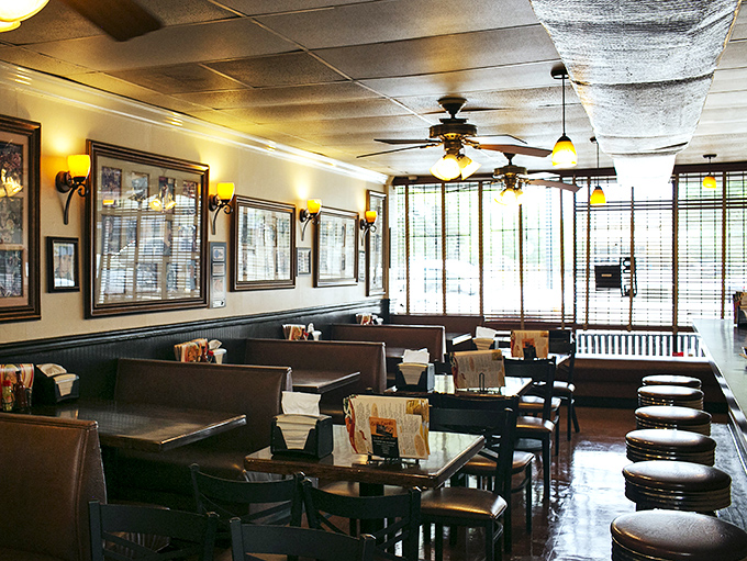 Warm lighting, wooden booths, and ceiling fans create that "grandma's dining room" vibe where time slows down and conversations flow as smoothly as the gravy.