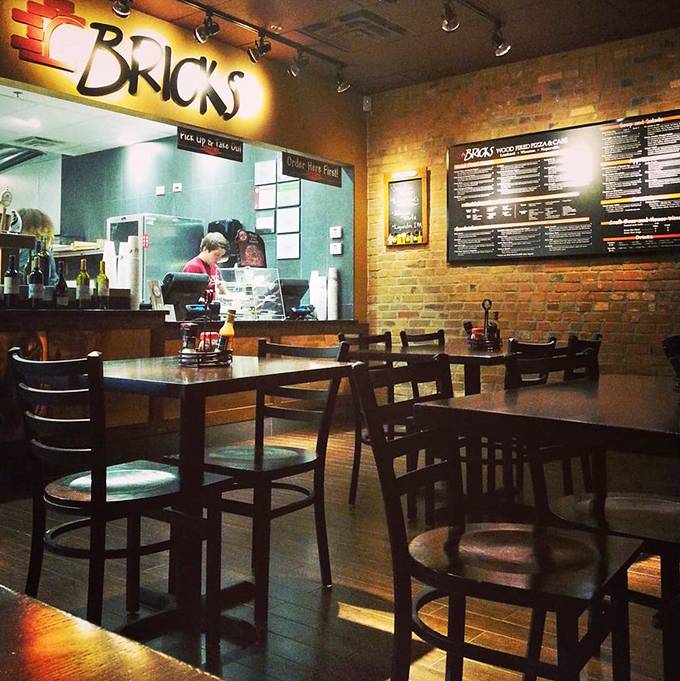 Warm brick walls and wooden tables create the perfect backdrop for pizza contemplation in this cozy Wheaton hideaway.