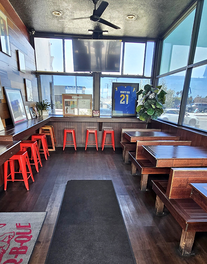 Simple wooden benches and bright red stools say it all: you're here for the food, not fancy decor. That Rams jersey speaks to deep local roots.