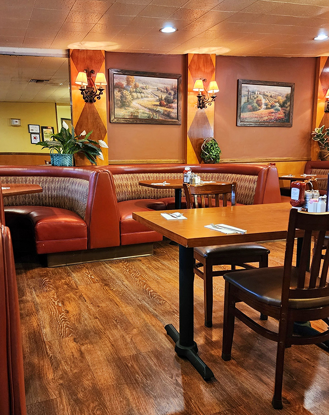 Cozy burgundy booths and warm wood tones welcome you like an old friend. This isn't Instagram-bait decor&mdash;it's the real deal comfort zone.