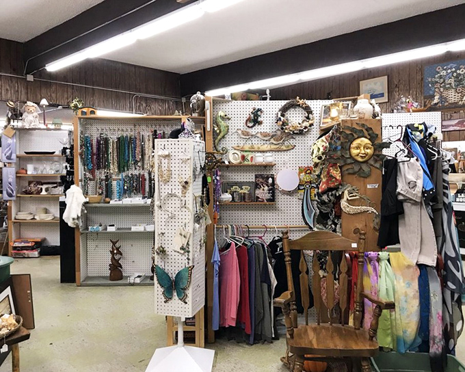 Pegboard paradise! Jewelry, clothing, and that celestial sun face watching over it all like a thrift store guardian angel.