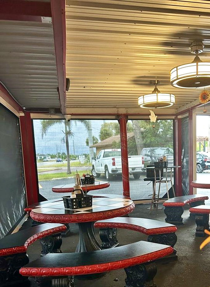 These vintage red-trimmed tables aren't just seating&mdash;they're time machines to when conversation was the only thing we scrolled through during dinner.