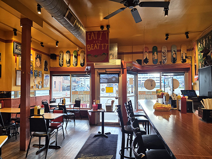 Skateboard decks line the walls while the "Eat It and Beat It" sign tells you everything about the vibe: fun, irreverent, and deliciously unpretentious.