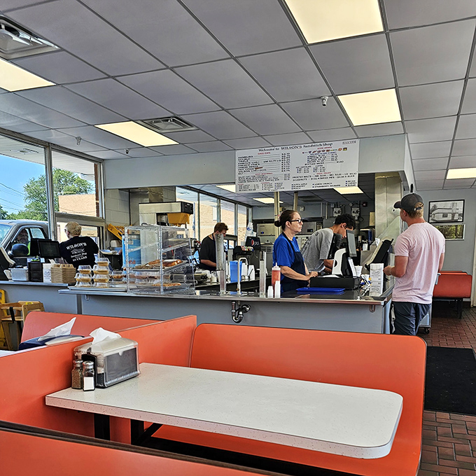 Inside Wilson's, time stands deliciously still. Those orange booths have witnessed more food epiphanies than a cooking show marathon.