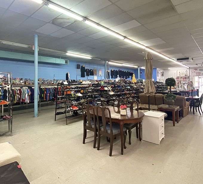 Organized chaos at its finest&mdash;racks of clothing stretch toward fluorescent horizons while furniture islands create an archipelago of potential living room makeovers.