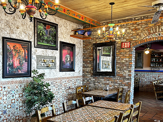 Exposed brick meets colorful tile work in this dining room that feels like your favorite aunt's house in Mexico&mdash;if your aunt had impeccable taste in folk art.