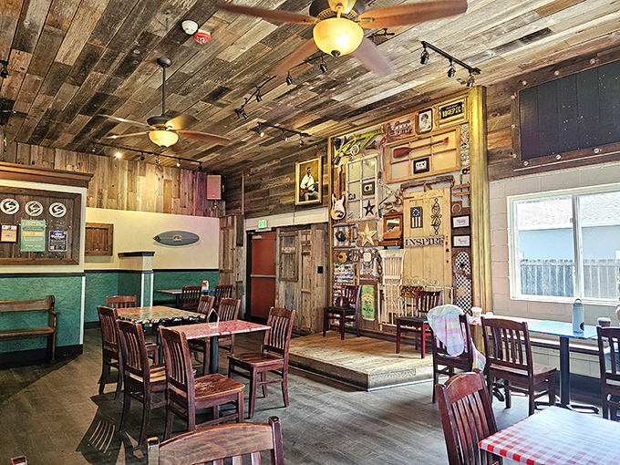 Step inside and the rustic wood-paneled interior feels like the living room of that friend who always throws the best backyard cookouts.