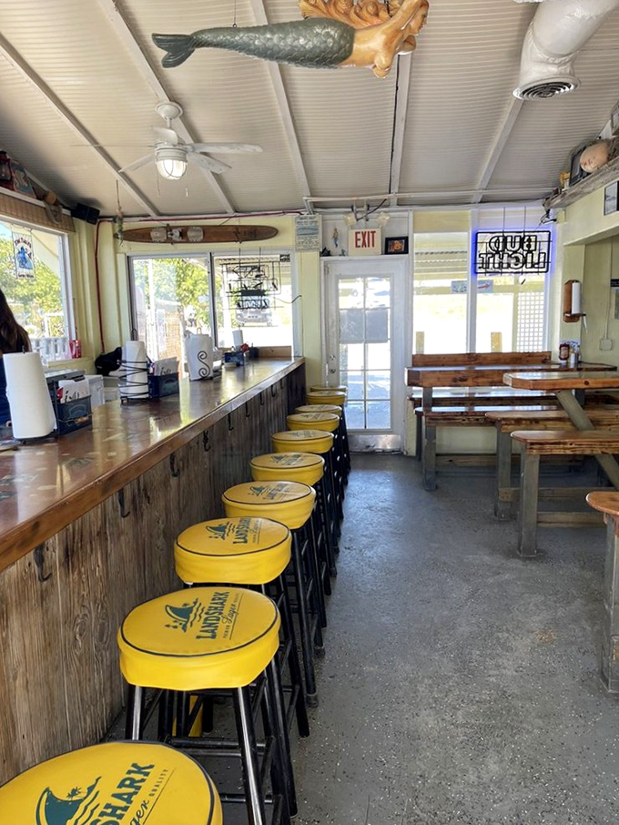 Step inside where yellow stools and maritime charm create the perfect backdrop for culinary magic.