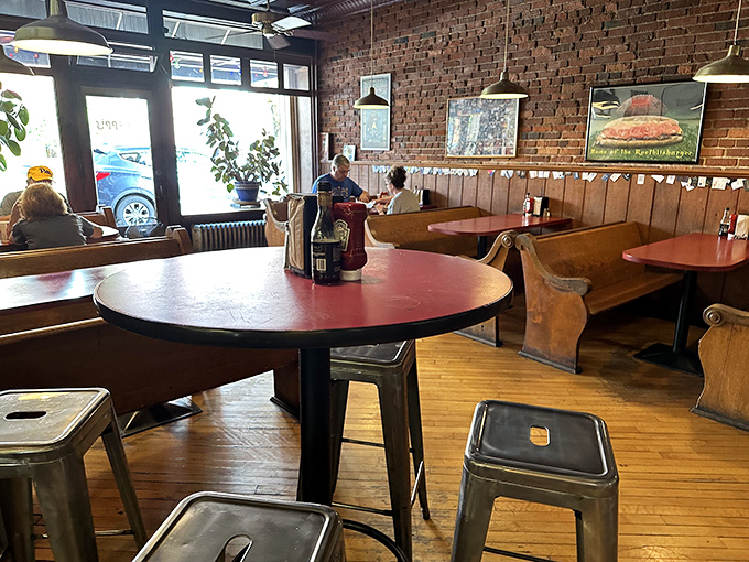 Exposed brick walls and wooden booths create that perfect "been-here-forever" vibe. This isn't interior design&mdash;it's sandwich authenticity in architectural form.