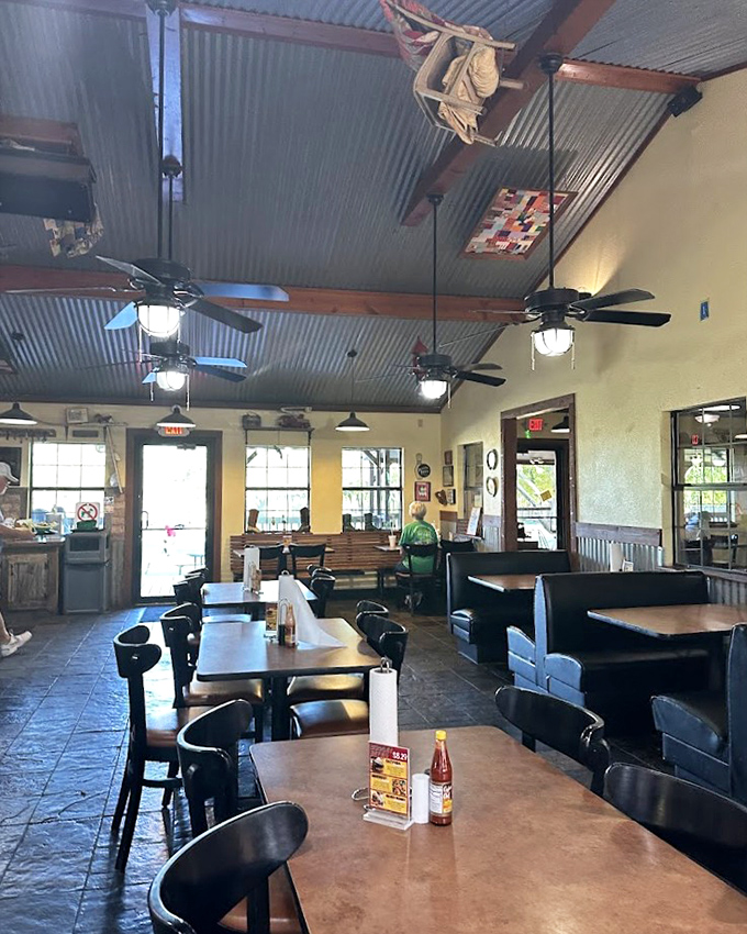 Where corrugated metal meets comfort. The tin ceiling, ceiling fans, and warm lighting create that perfect "I've discovered something special" atmosphere locals treasure.