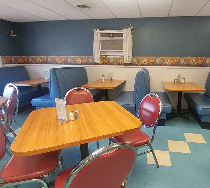 Classic blue vinyl booths and retro chairs create that perfect "time stood still" atmosphere where conversations flow as freely as the coffee.