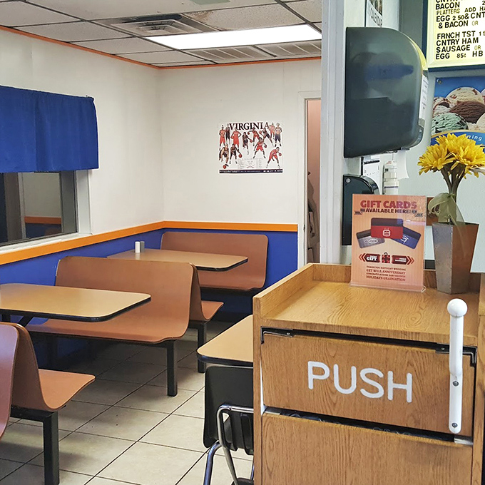 Blue and orange booths pay homage to UVA colors, while the simple interior whispers a timeless truth: the best food doesn't need fancy surroundings.
