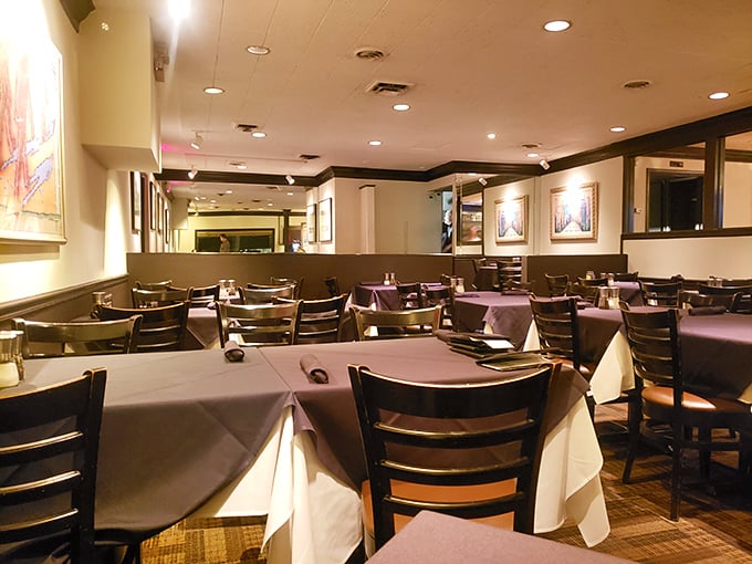 Crisp white tablecloths meet purple accents in this intimate dining room where conversations flow as smoothly as their house wines.