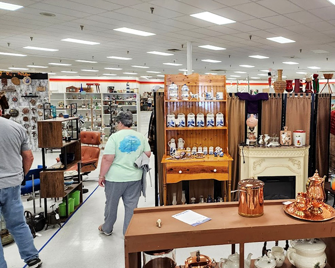 Vendor booths create a labyrinth of nostalgia where shoppers navigate through decades of American history one display at a time.