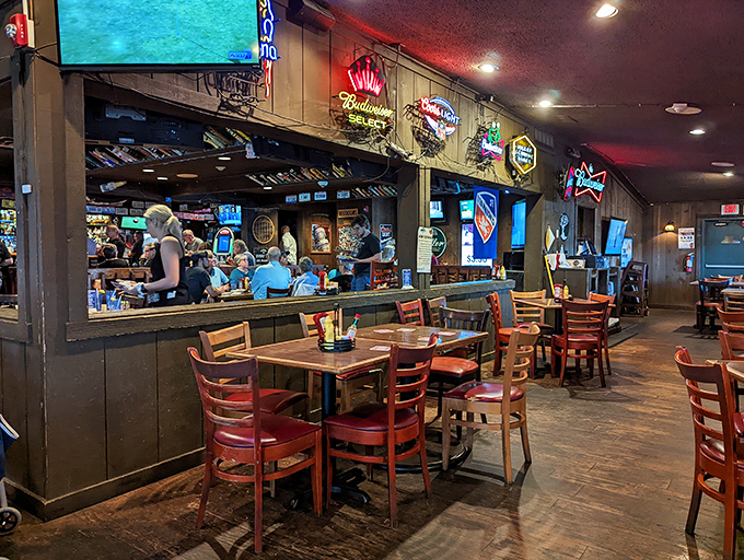 Where everybody knows your name—or soon will. The warm wood-paneled interior strikes that perfect balance between sports bar energy and neighborhood hangout charm.