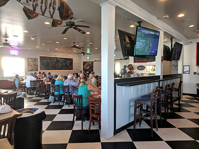 Black and white tiles play chess with your feet while nautical d&eacute;cor dangles overhead. This isn't just a restaurant; it's a maritime clubhouse where seafood reigns supreme.