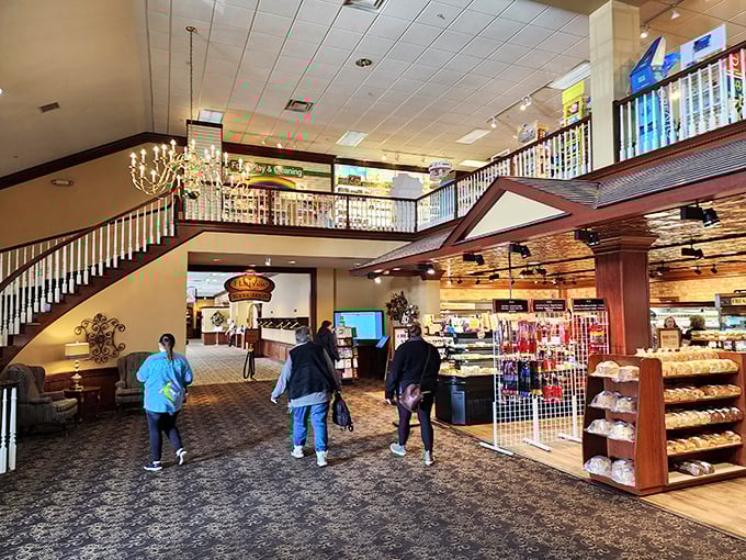 Step inside and the two-story interior immediately signals this isn't your average roadside eatery. That grand staircase leads to shopping heaven upstairs.