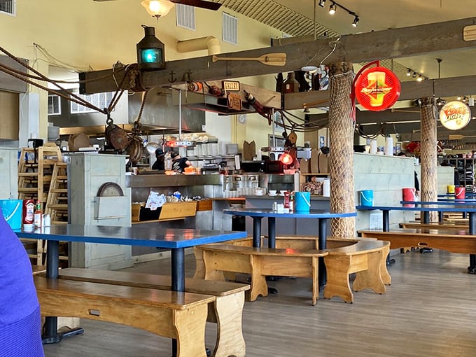 Fishing nets and nautical touches transform this dining room into a maritime adventure. The wooden benches practically whisper tales of storms weathered and catches landed.