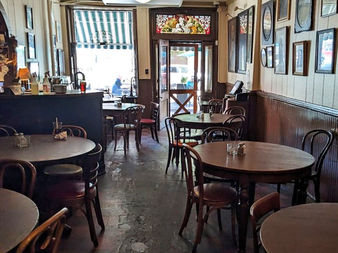 Bentwood chairs and worn wooden floors tell stories that the walls are too polite to share. History you can actually sit on!