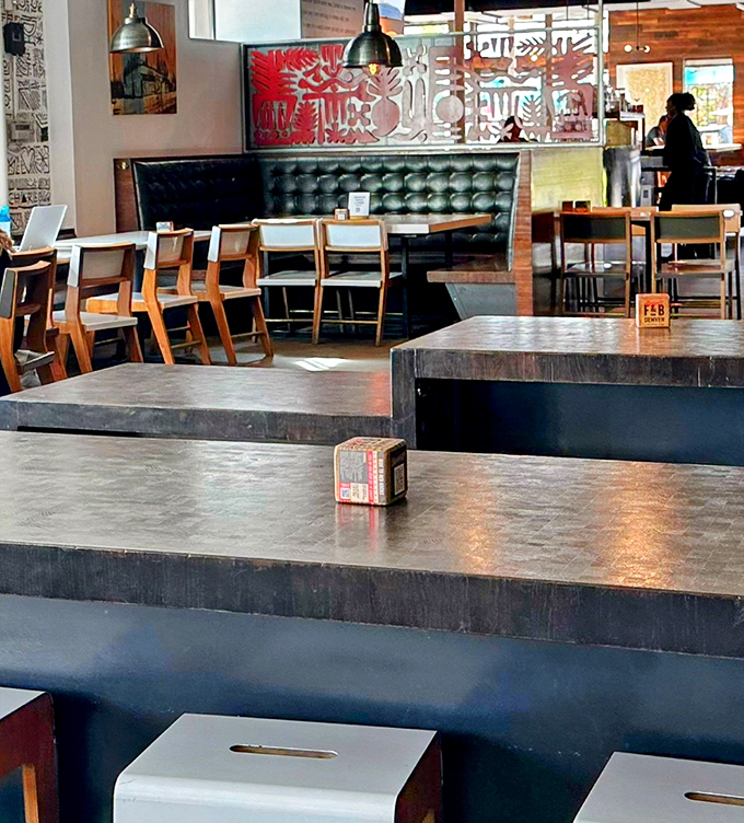 The interior blends sleek modern design with cozy comfort, creating the perfect backdrop for both serious foodies and casual diners seeking culinary adventure.