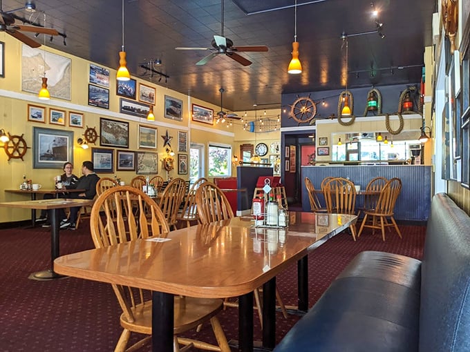 Nautical charm meets diner comfort inside Chelan Cafe, where ship wheels and wooden tables create the perfect backdrop for breakfast magic to unfold.