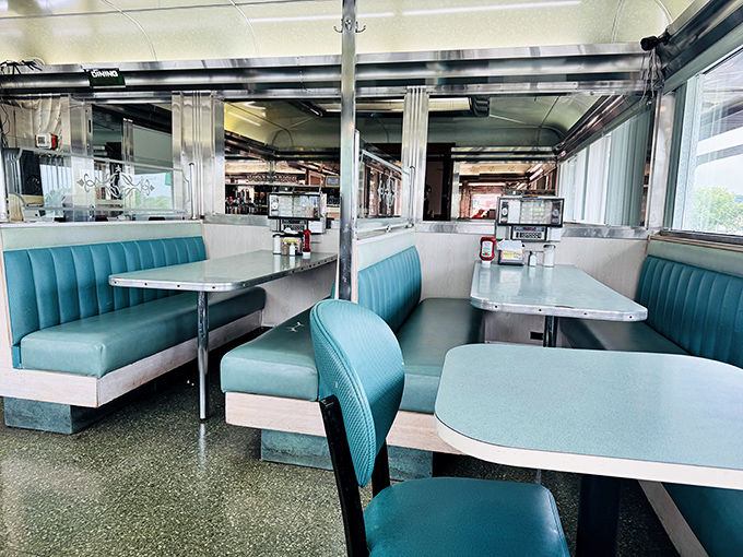 Those turquoise vinyl booths aren't trying to be retro—they're the real deal. Sliding into one feels like joining a secret society of comfort food connoisseurs.